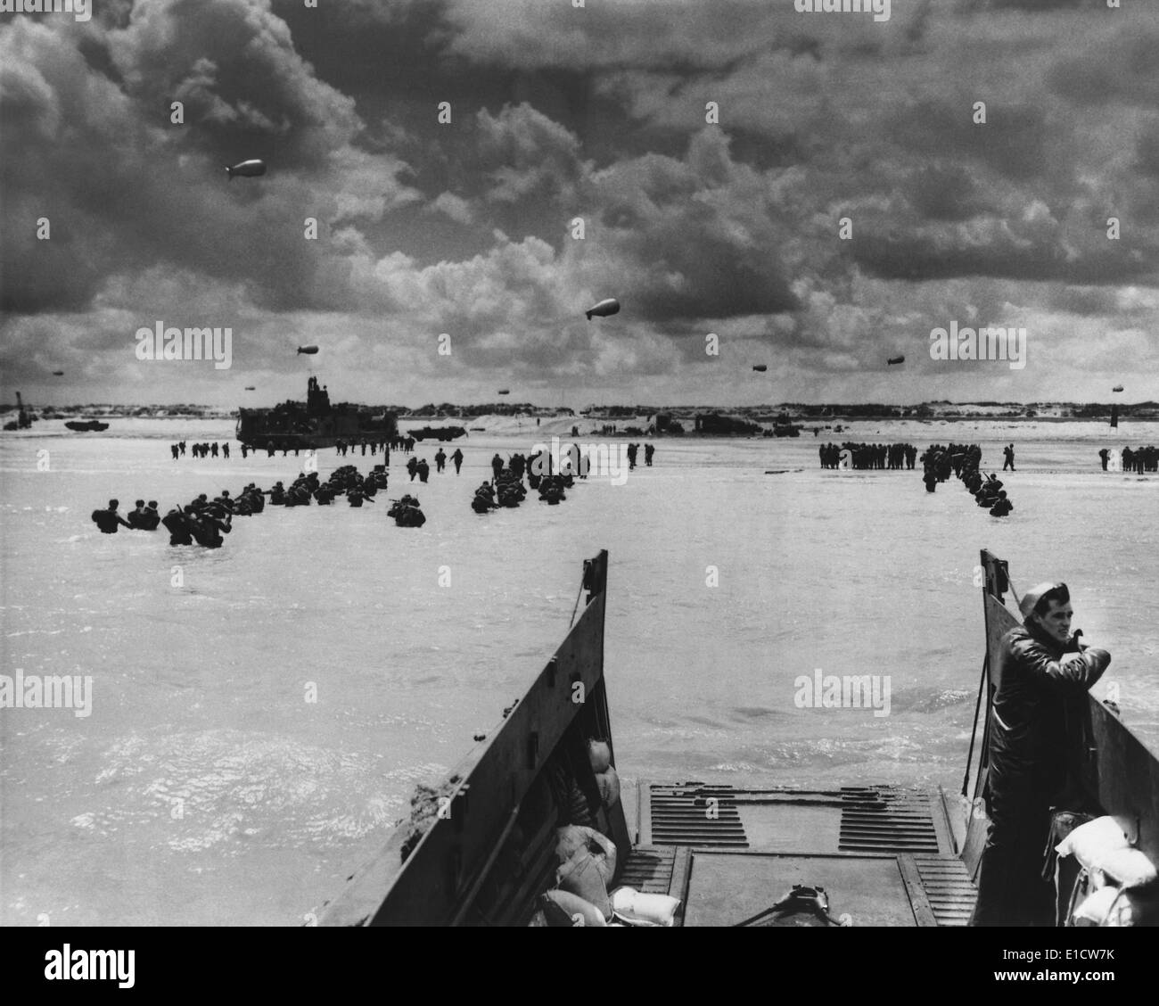 U.S. Troops land at Normandy on D-Day. With the beach taken and barrage ...