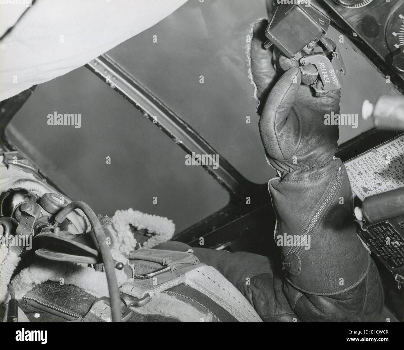 American Bombardier with his hand on the Bomb Release over Germany in ...