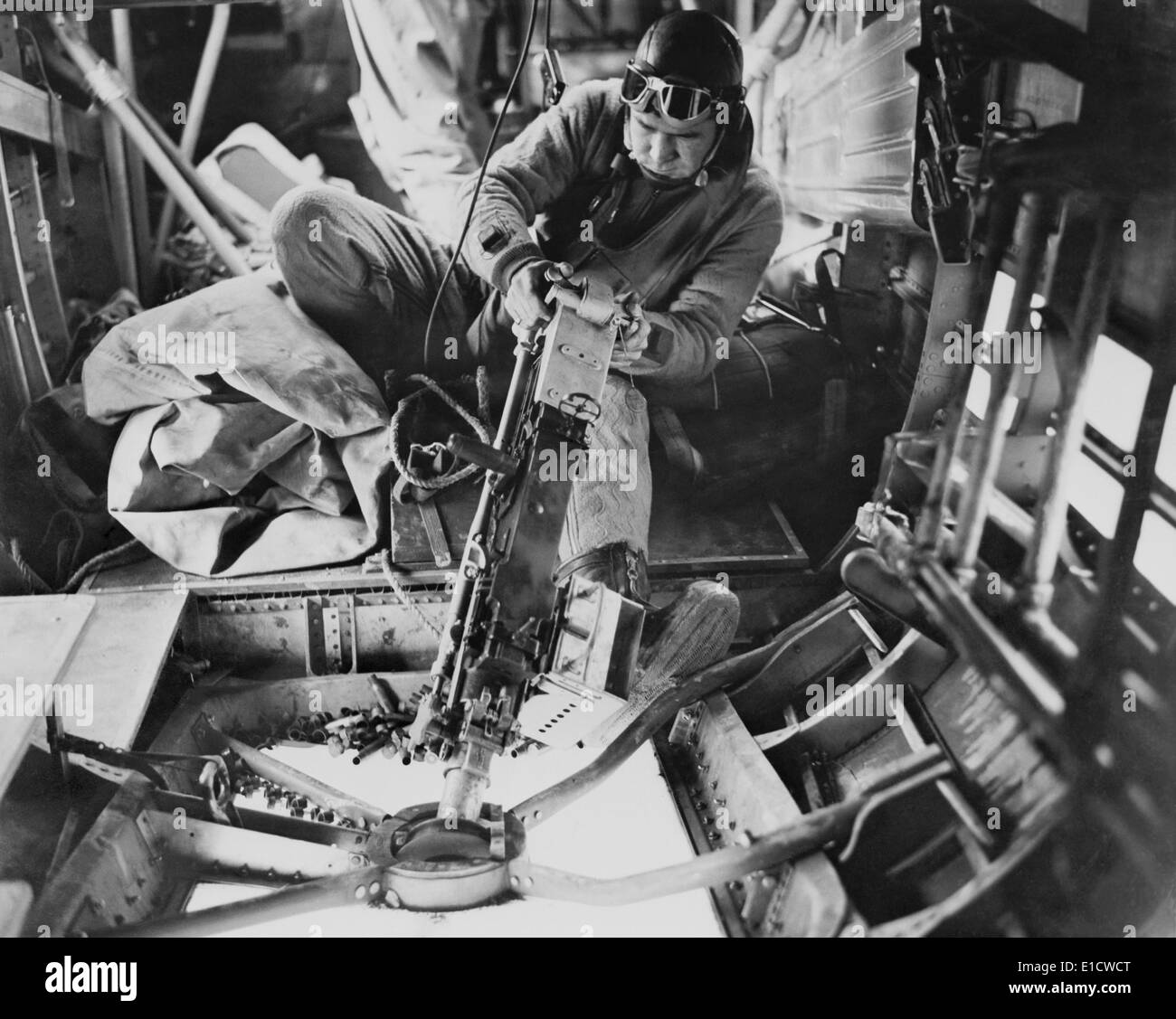 U.S. Army Air Force gunner operating a machine gun during a aerial ...