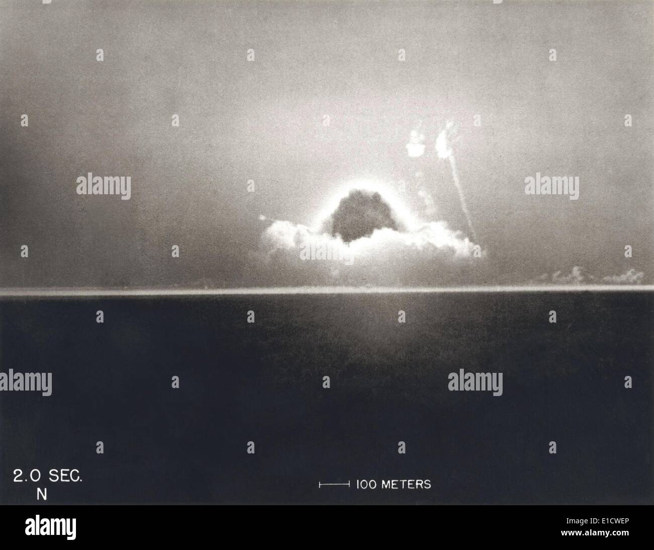 First Atomic Explosion on July 16, 1945. Photograph taken at 2 seconds ...