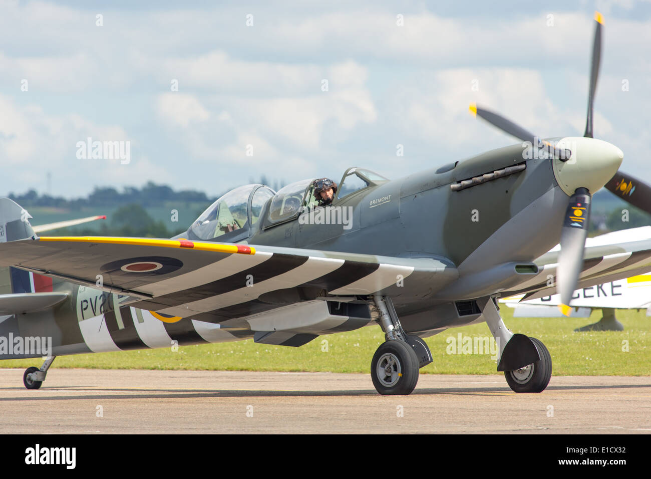 A World War II Spitfire fighter at Duxford Air Show in D-Day markings ...