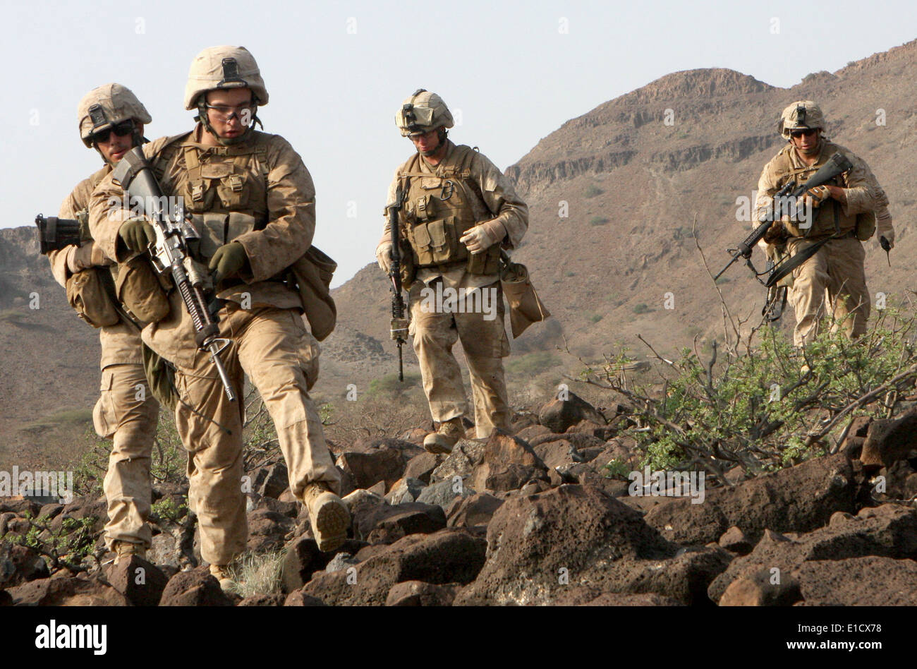 U.S. Marine Corps Lance Cpl. Spencer Cohen leads his team through rocky ...