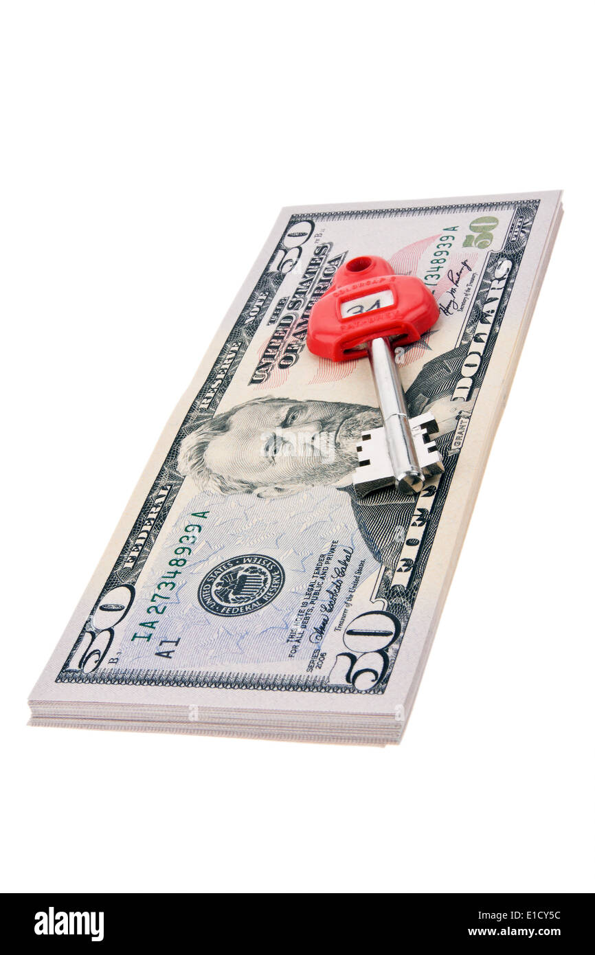 Dollar Currency notes and safe deposit key. Isolated on white ...