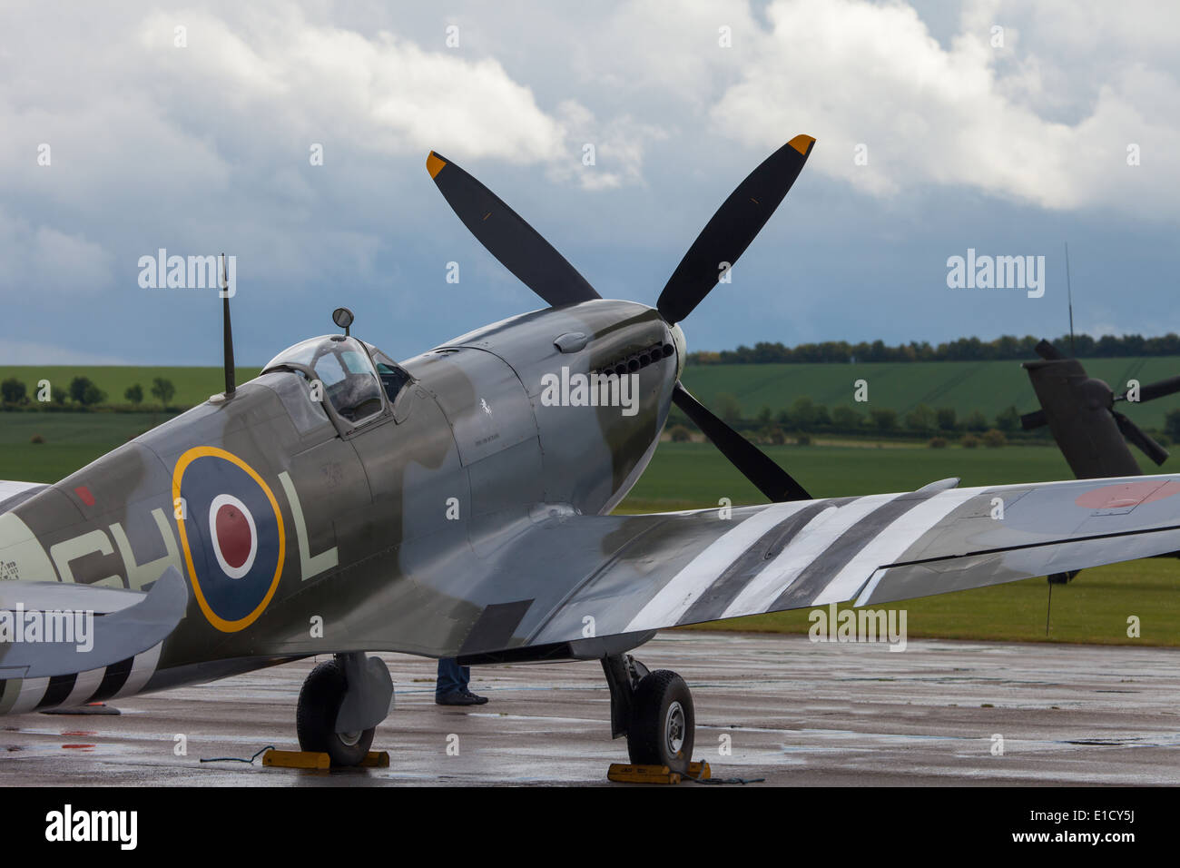 A World War II Spitfire fighter at Duxford Air Show in D-Day markings ...