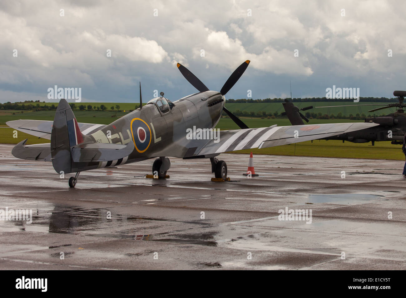 A World War II Spitfire fighter at Duxford Air Show in D-Day markings ...