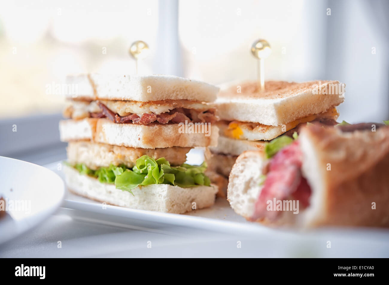 fresh and delicious classic club sandwich on white dish Stock Photo - Alamy