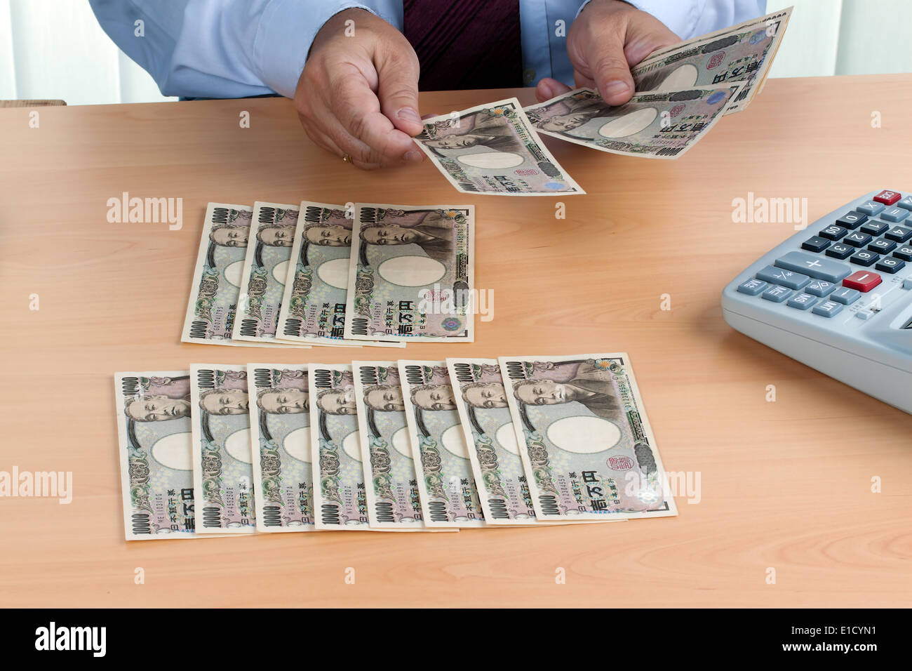 Japanese yen notes. Currency in Japan is counted by hands Stock Photo ...