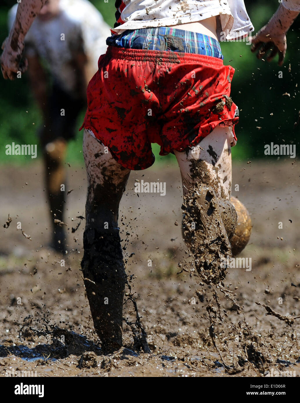 Mud football player hi-res stock photography and images - Alamy