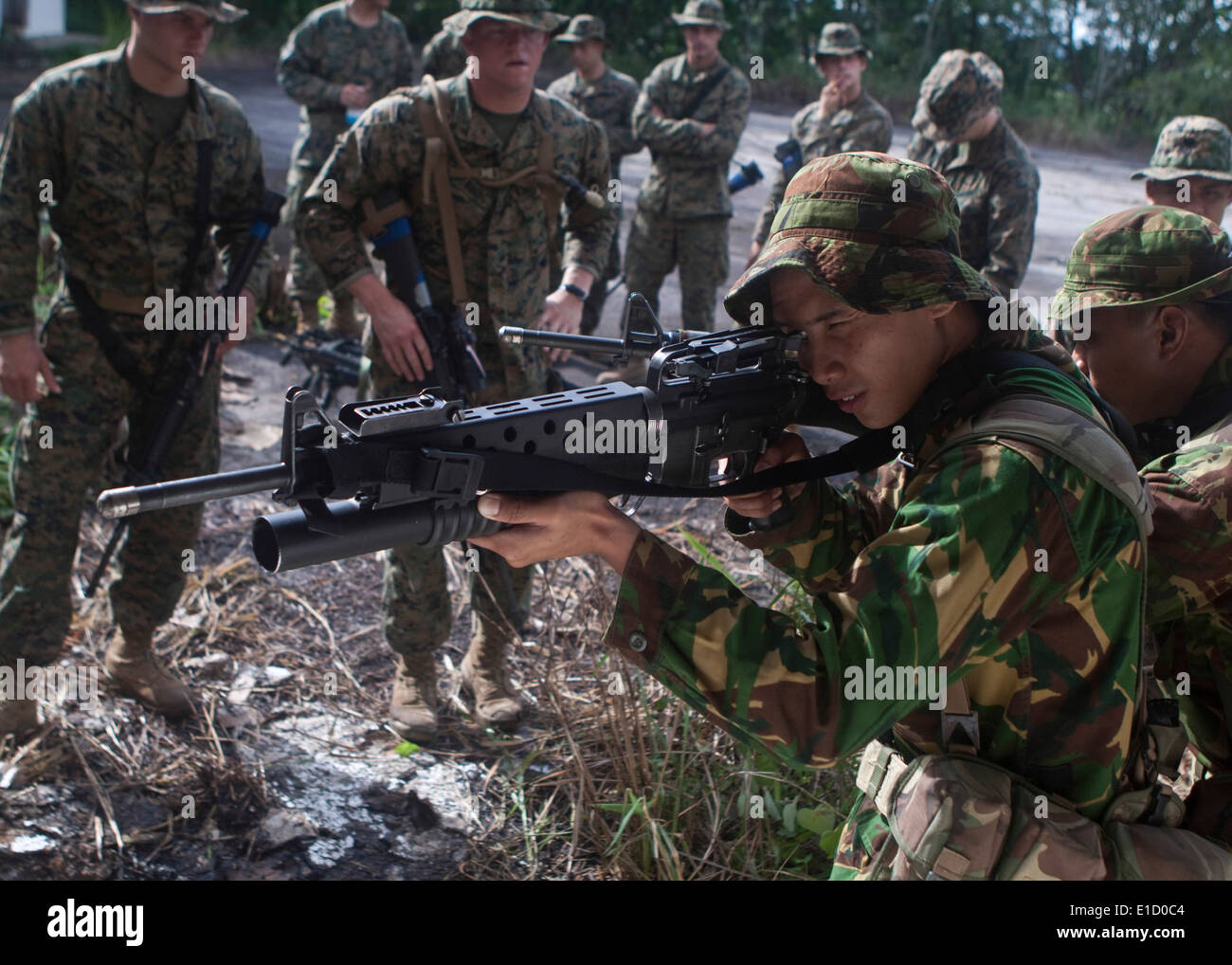 A Royal Brunei Land Forces soldier prepares to enter a room as part of ...