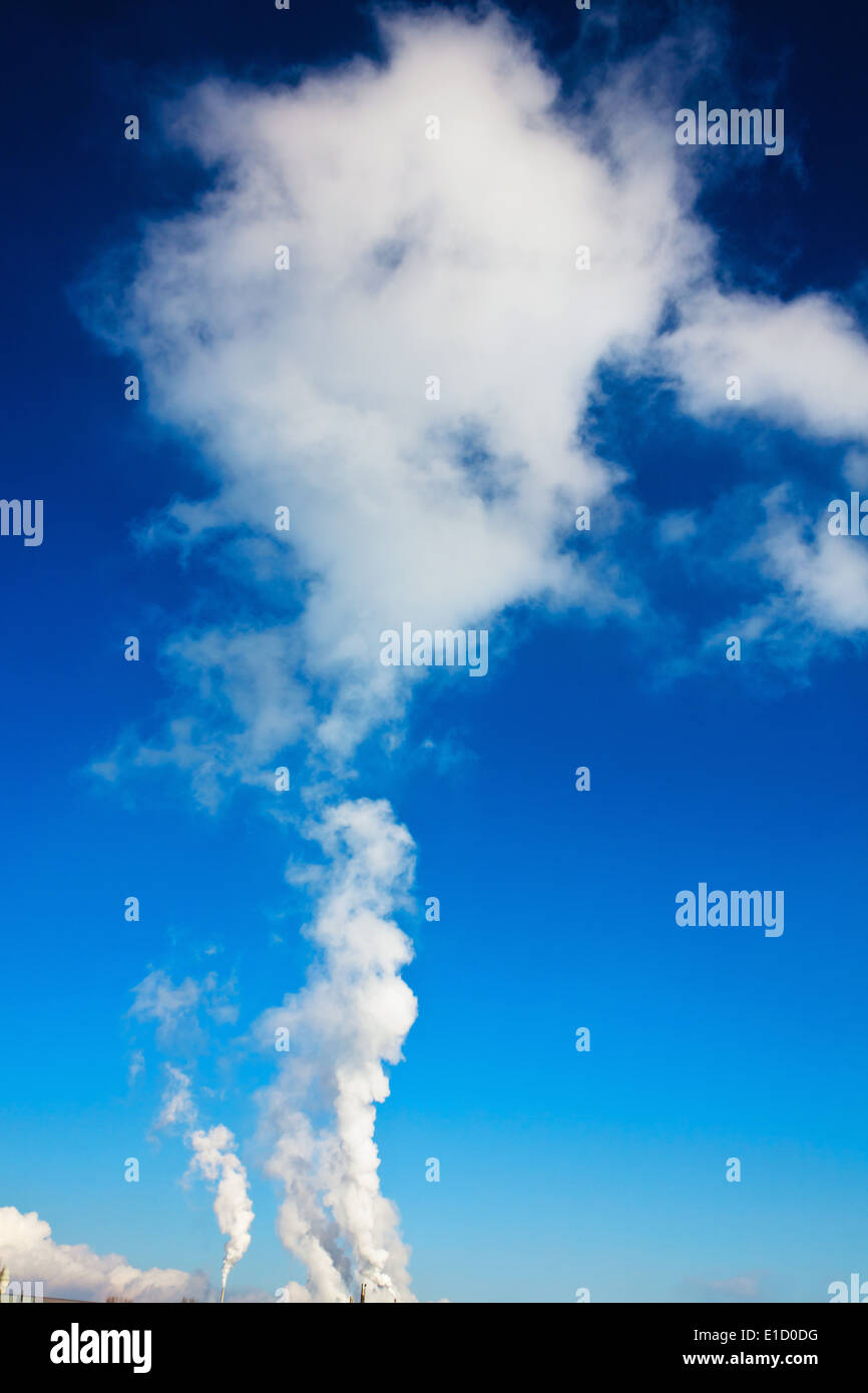 Industrial waste gases from a chimney. Smog cloud of smoke against a ...