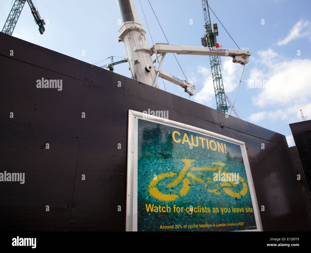Safety warning sign for HGV drivers about cyclists on London building ...