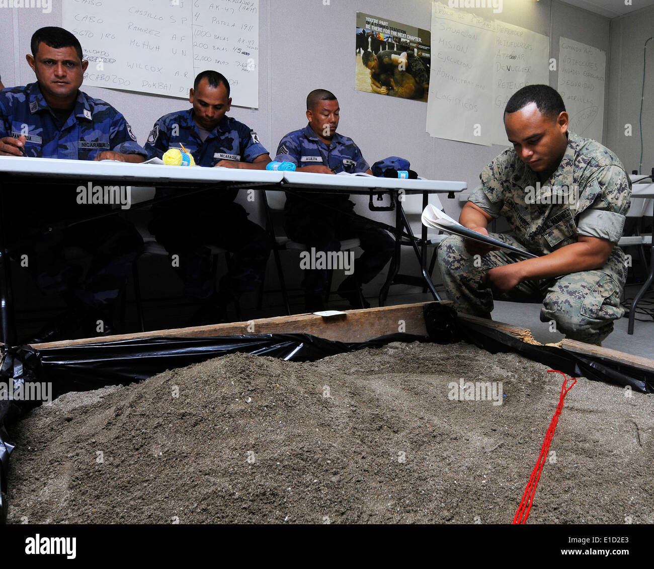 U.S. Marine Corps Sgt. Juan Martinez, right, prepares a 3D terrain ...