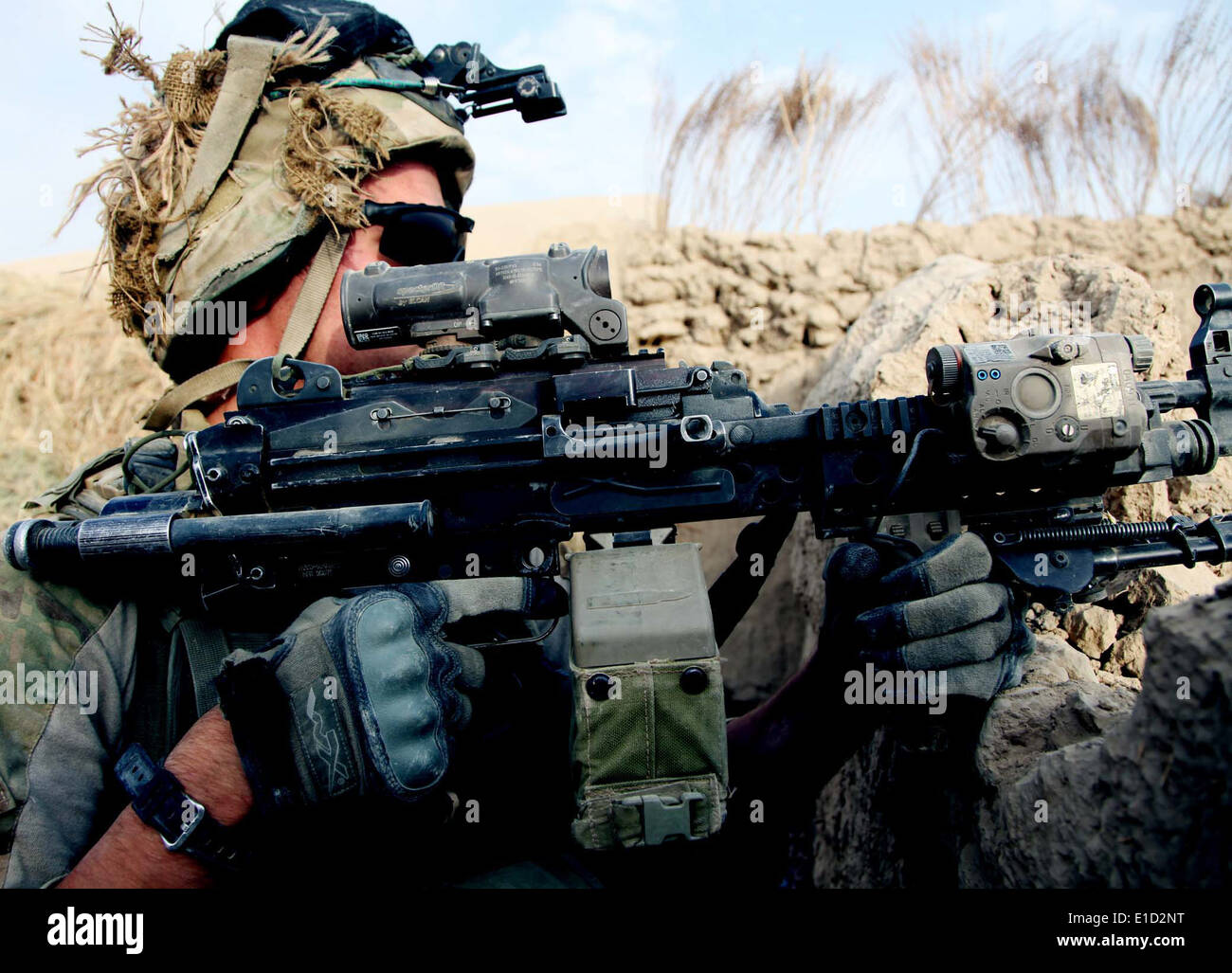 A member of a joint Afghan-International Security Assistance Force team ...