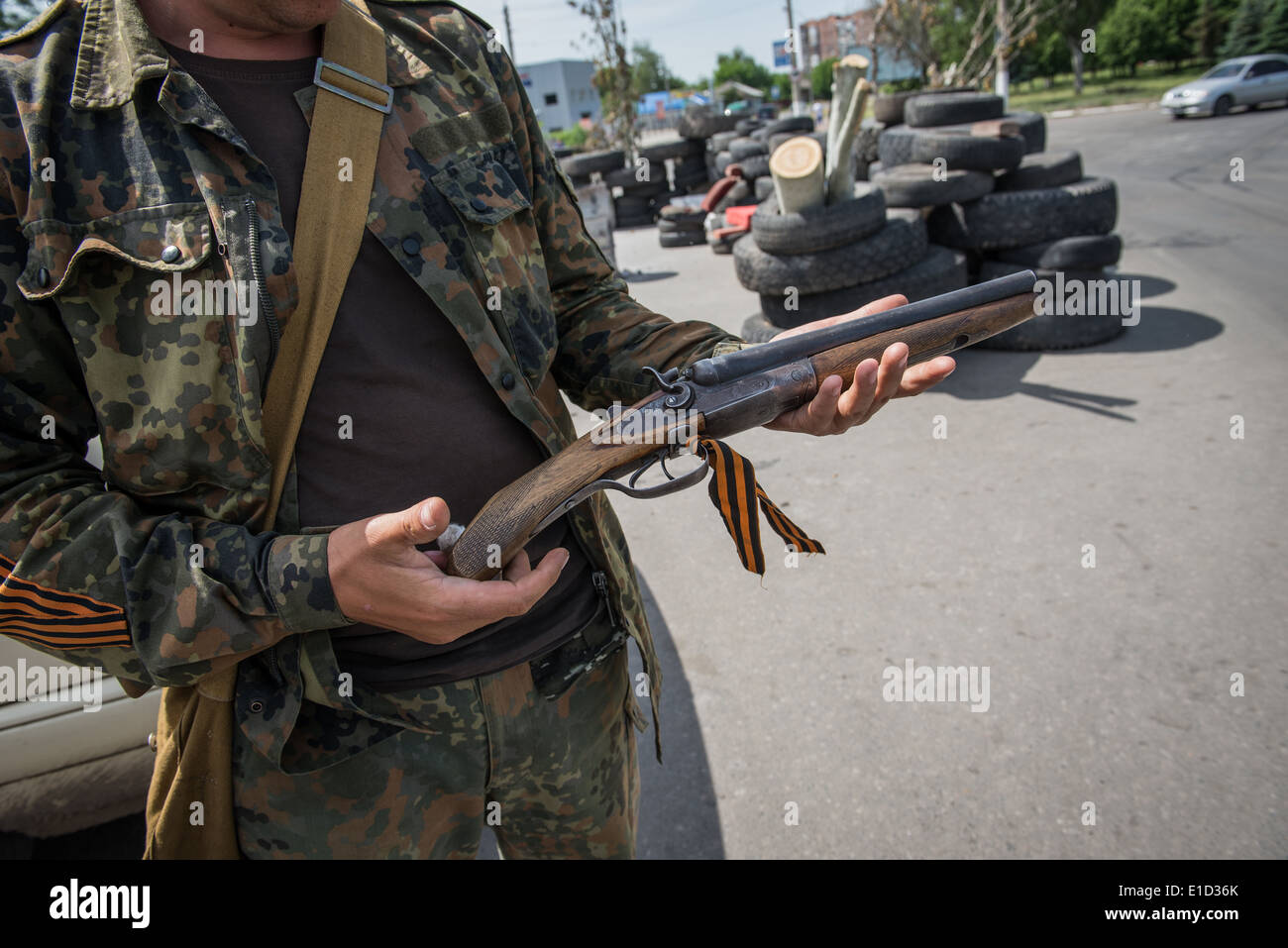 militant showing his gun on Pro-Russian militia checkpoint in Sloviansk ...