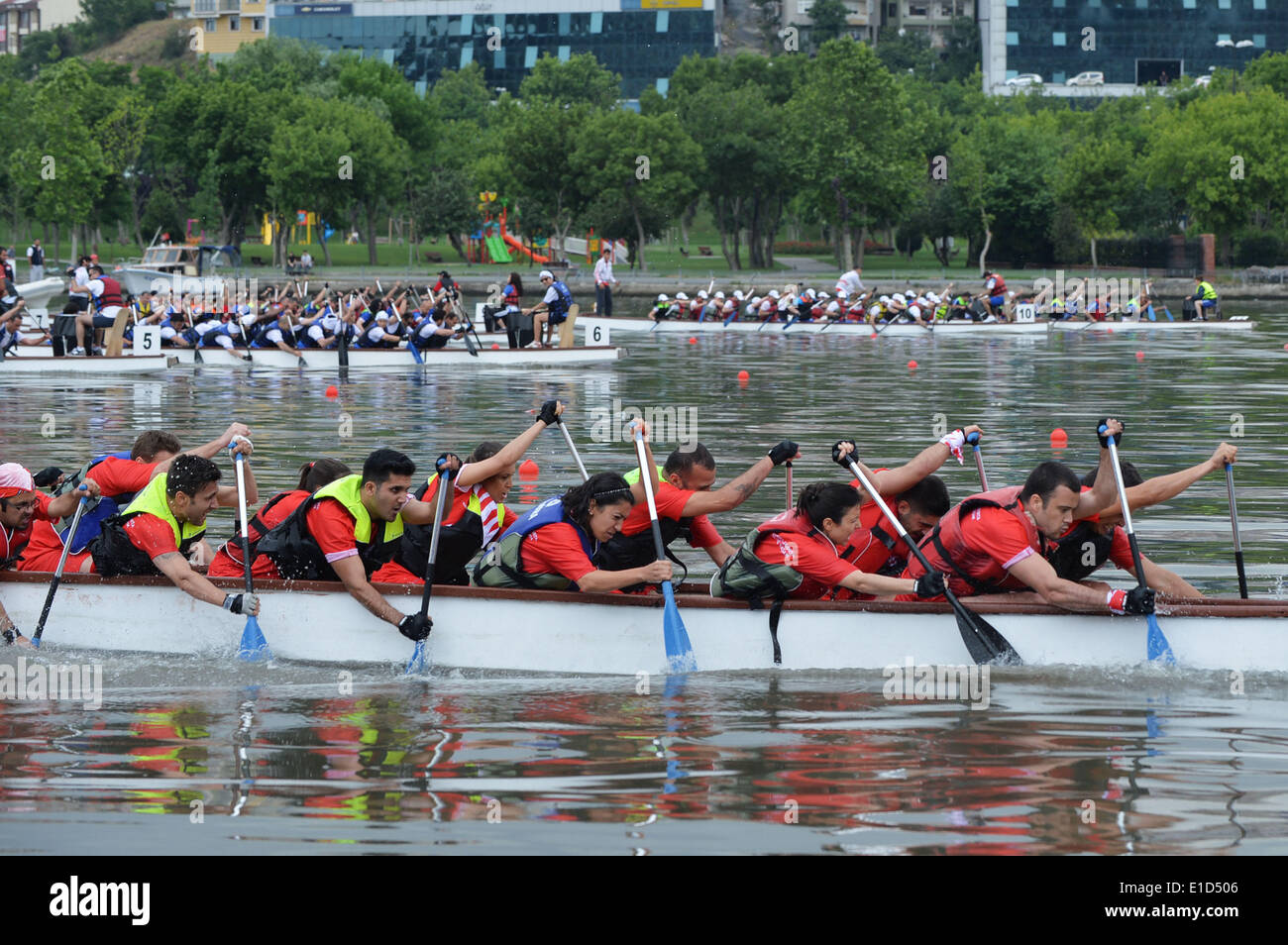 Istanbul. 31st May, 2014. Competitors paddle in dragon boat race in ...
