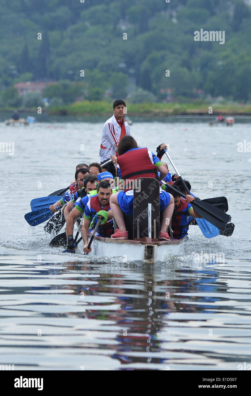 Istanbul. 31st May, 2014. Competitors paddle in dragon boat race in ...