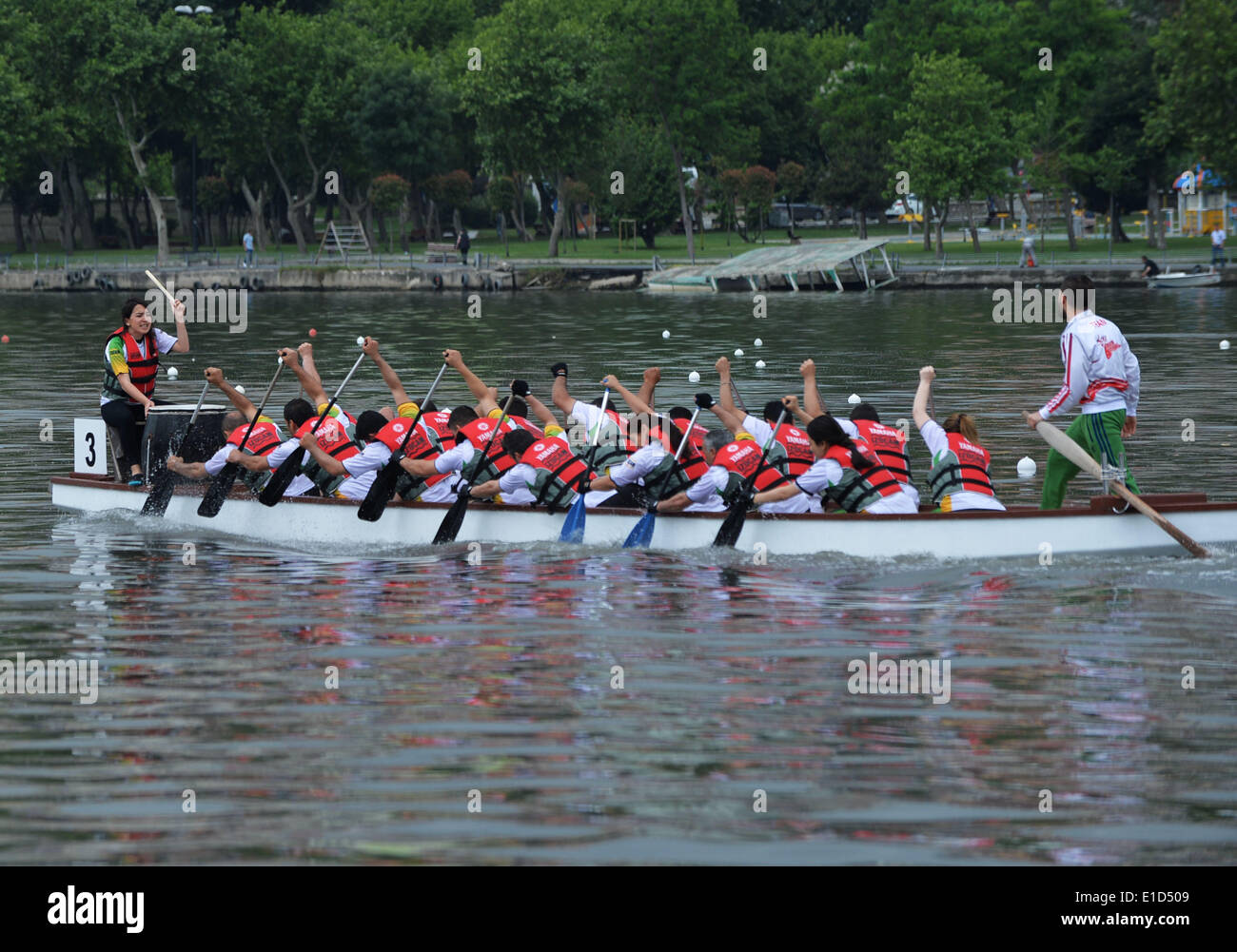 Istanbul. 31st May, 2014. Competitors paddle in dragon boat race in ...