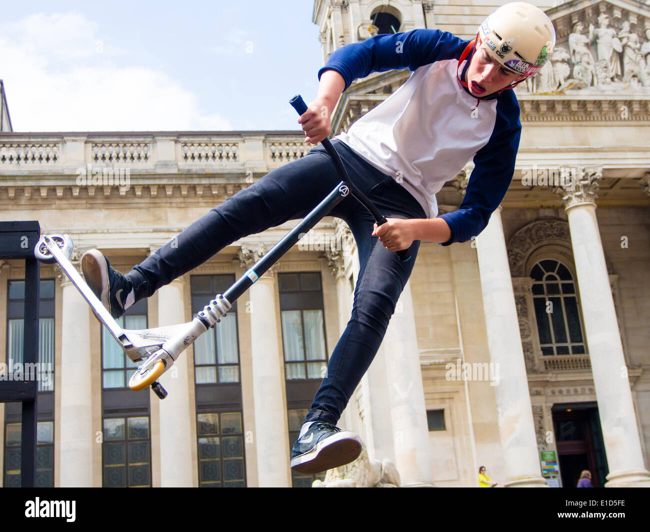 A scooter rider performs an aerial stunt in front of the Portsmouth ...