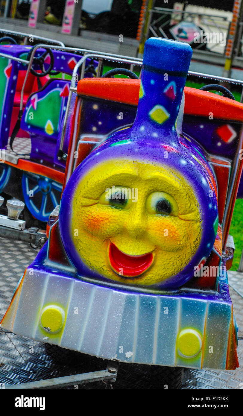 Toy train face fun fair ride Stock Photo - Alamy