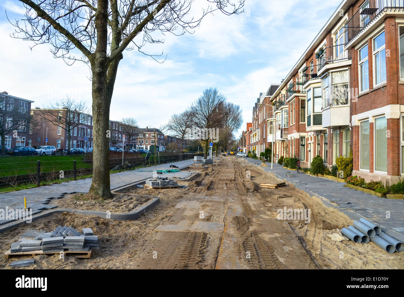 paviours at work in street in town Stock Photo - Alamy