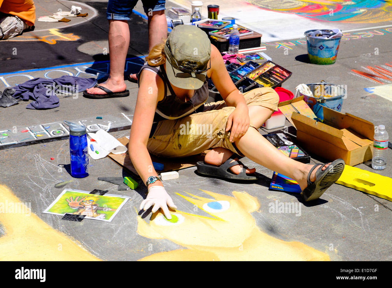 Denver, Colorado USA – 31 May 2014. Chalk artist Alex Miller sketches a ...