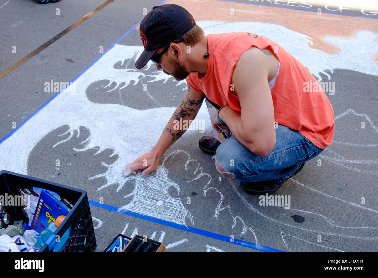 Denver, Colorado USA – 31 May 2014. Steven Kuc sketches a mural on the ...