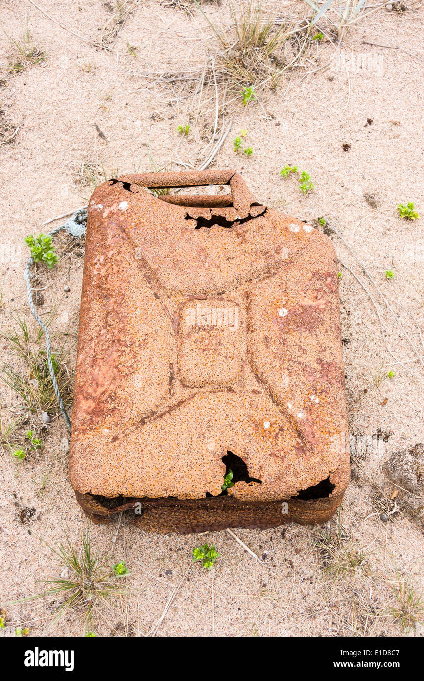 Big old rusty fuel jerrican or cannister at sand Stock Photo - Alamy