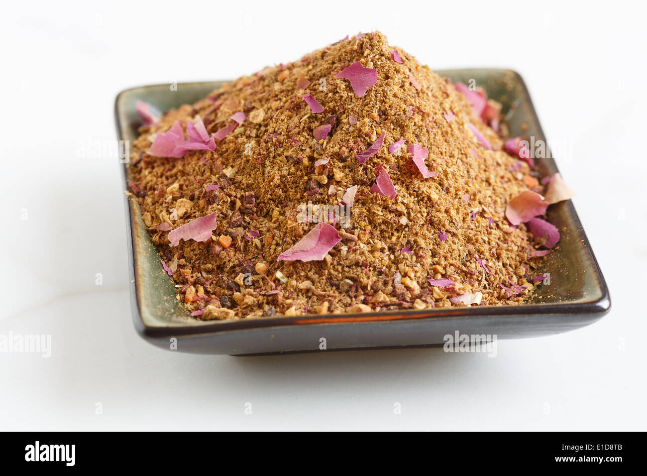 Spice mix rose petals bowl ground heap curry powder hi-res stock ...