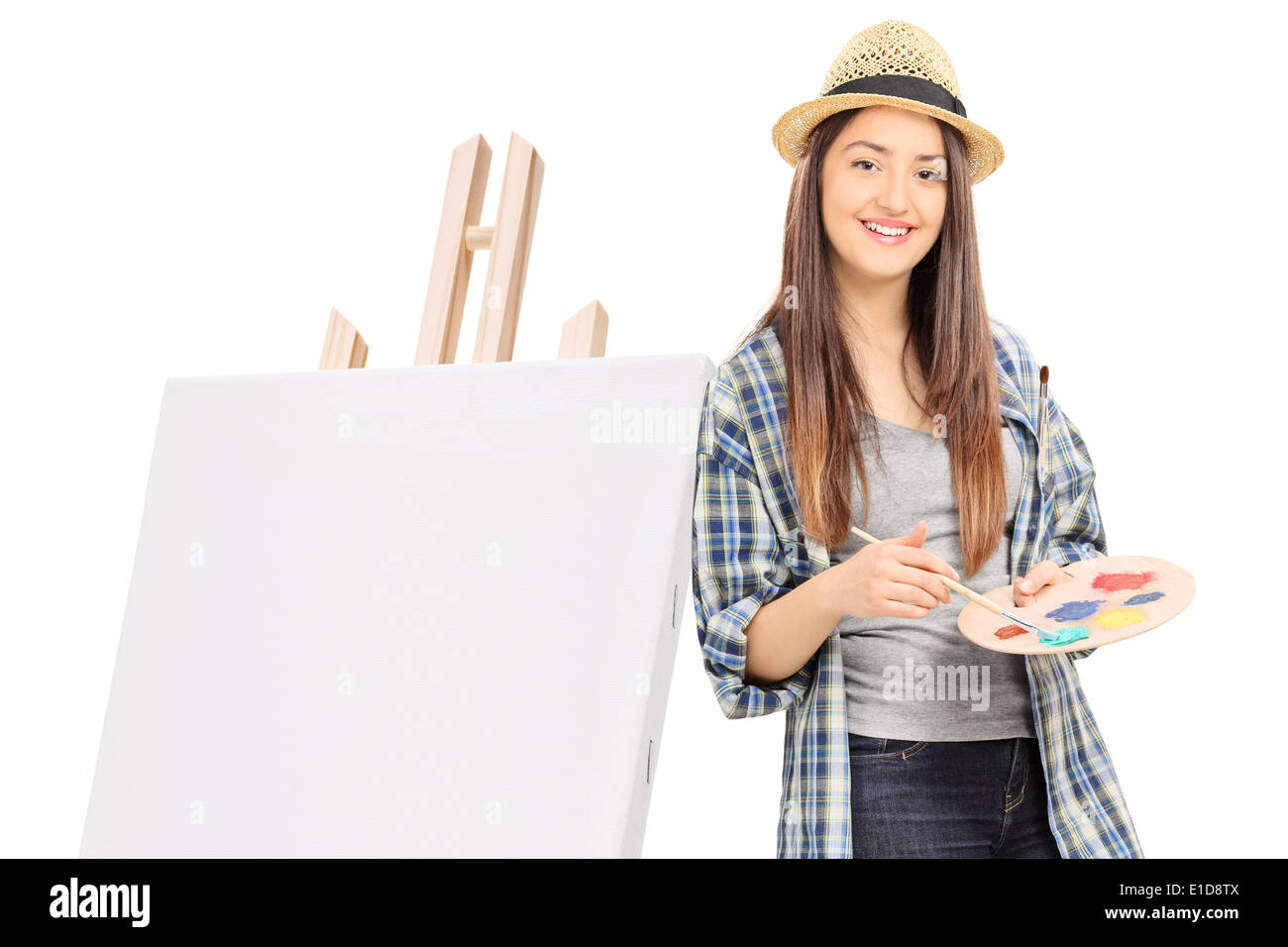 Female artist leaning on a canvas Stock Photo - Alamy
