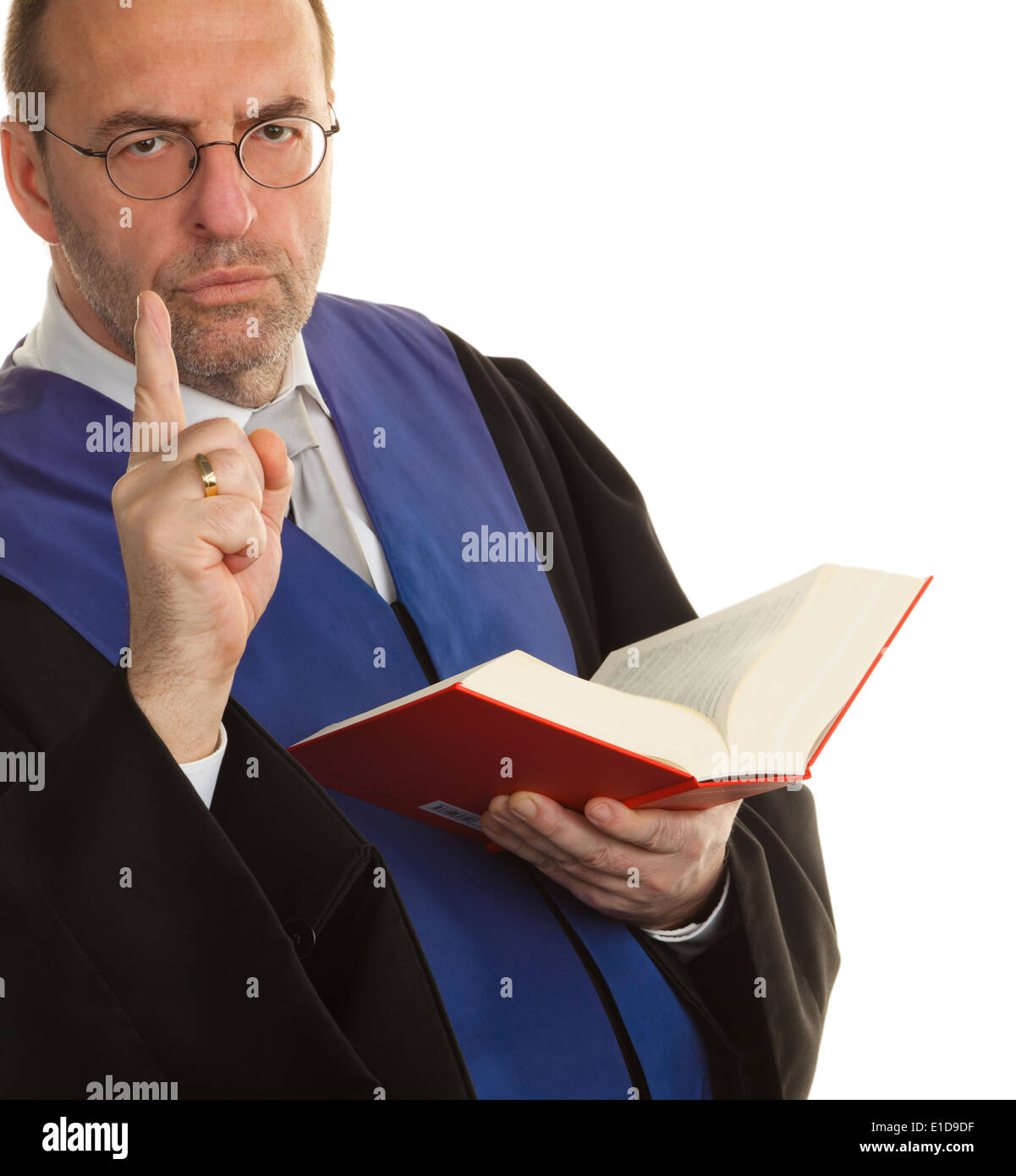 A judge with a law book at court. Gavel in hand Stock Photo - Alamy