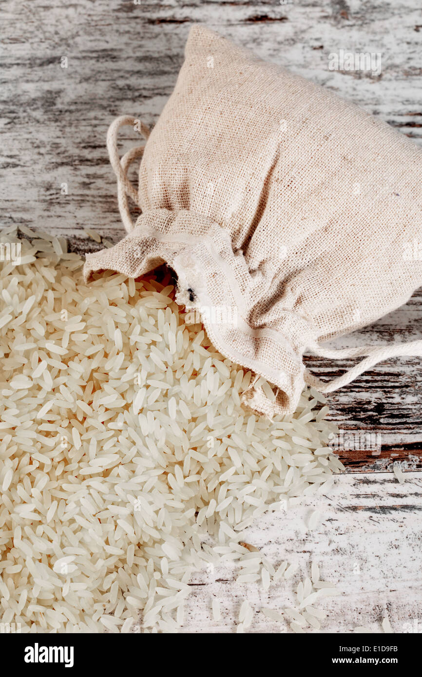 burlap sack full of rice Stock Photo - Alamy