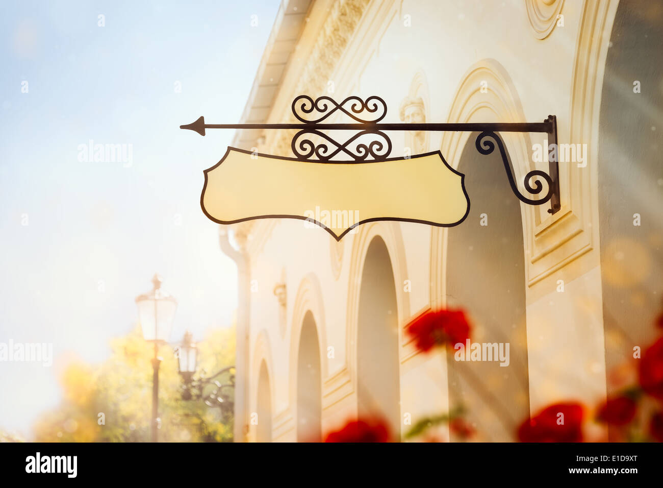 Building with a Wrought Iron Sign Stock Photo - Alamy