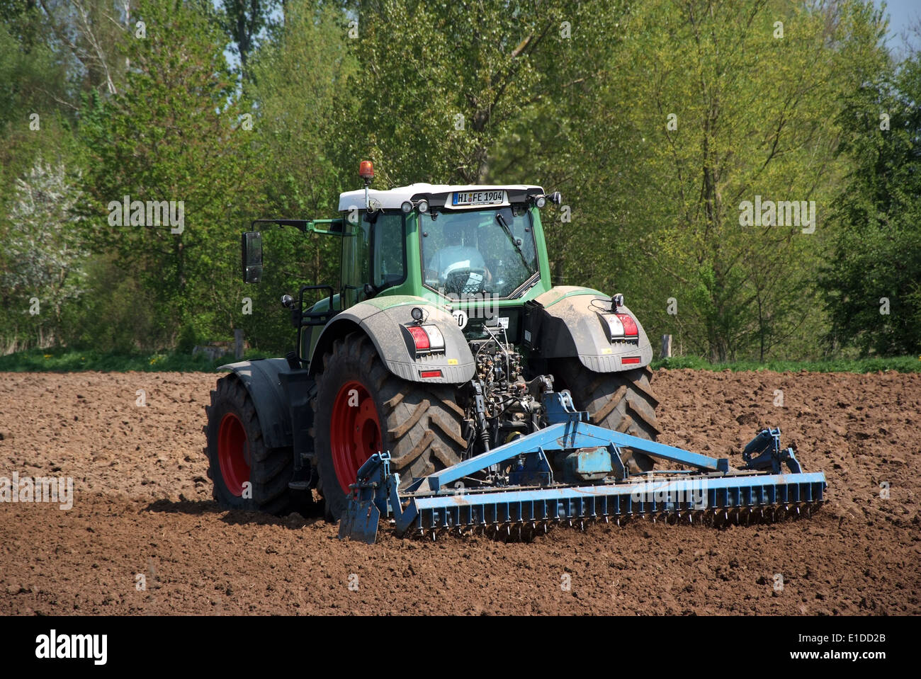 tractor ploughing field germany Stock Photo - Alamy