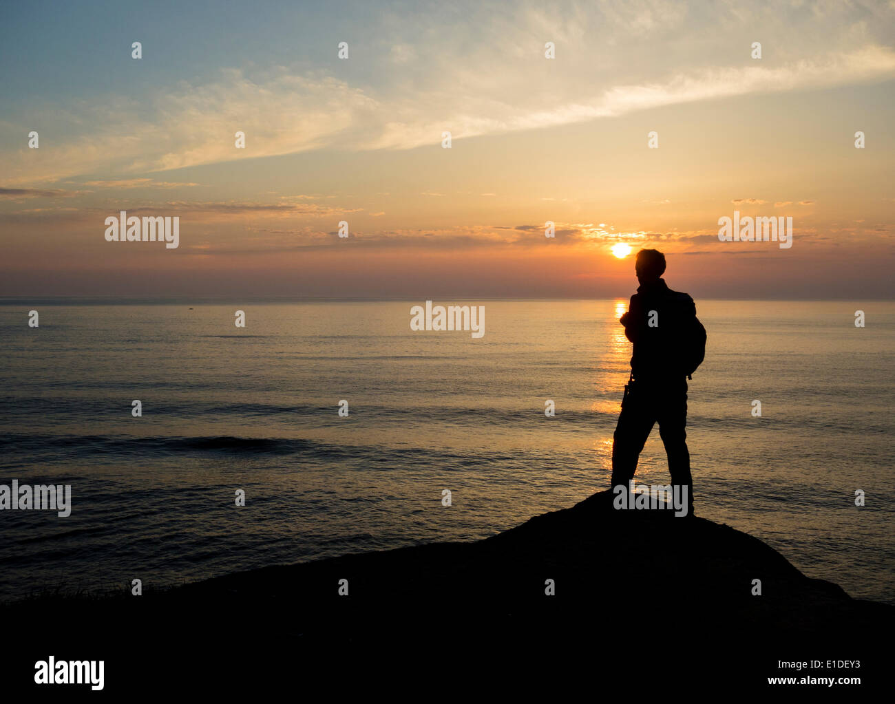 Walker at Nose`s Point near Seaham at sunrise on the Durham Heritage ...