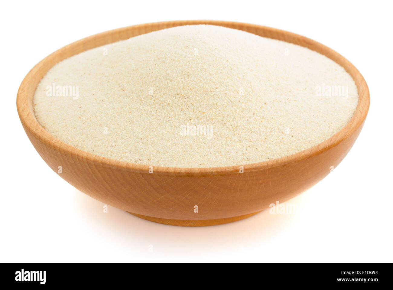 semolina in plate bowl on white background Stock Photo - Alamy