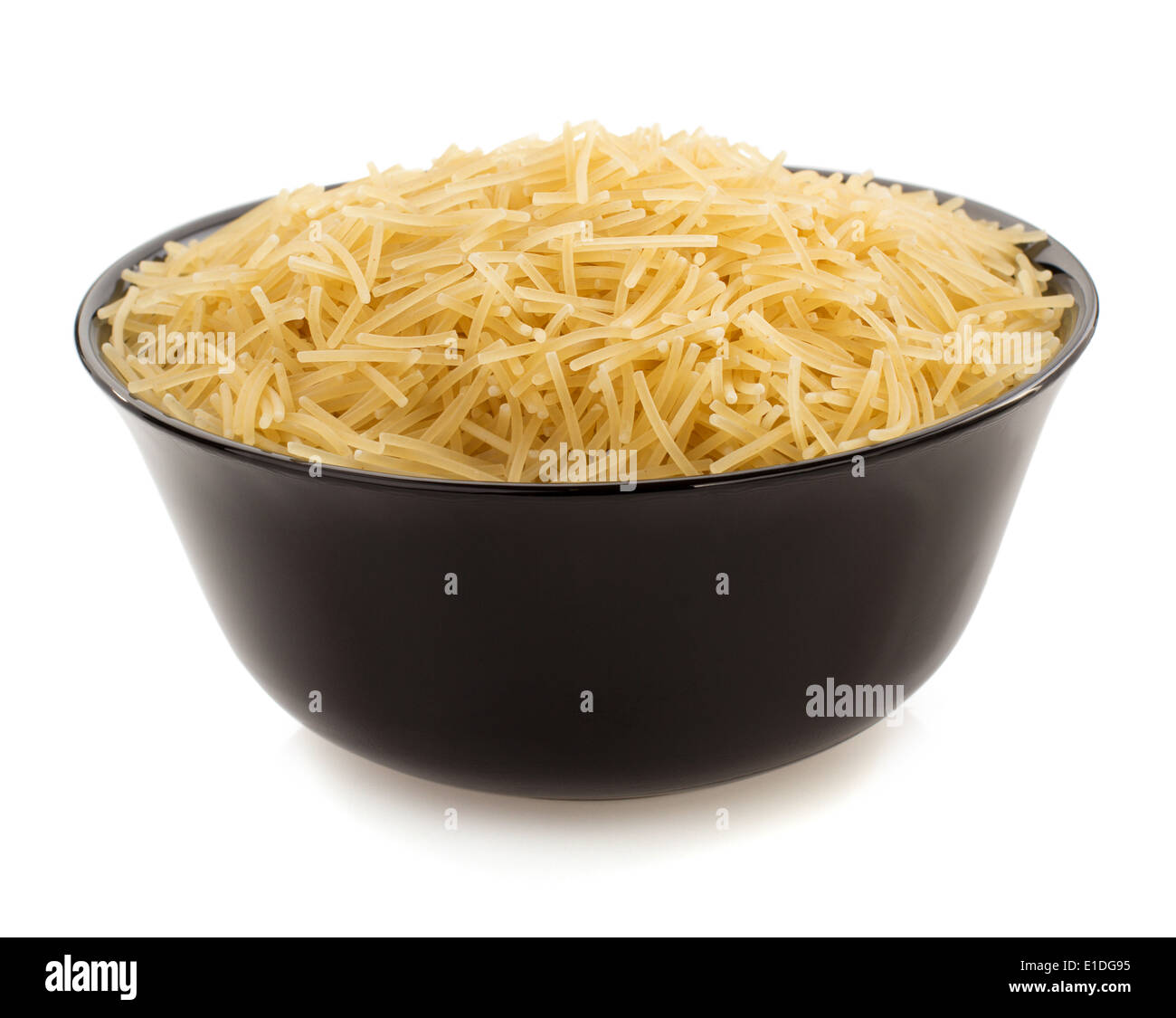 raw pasta in bowl isolated on white background Stock Photo - Alamy