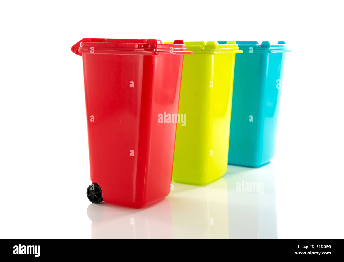 red blue and yellow green garbage bin isolated on white Stock Photo - Alamy