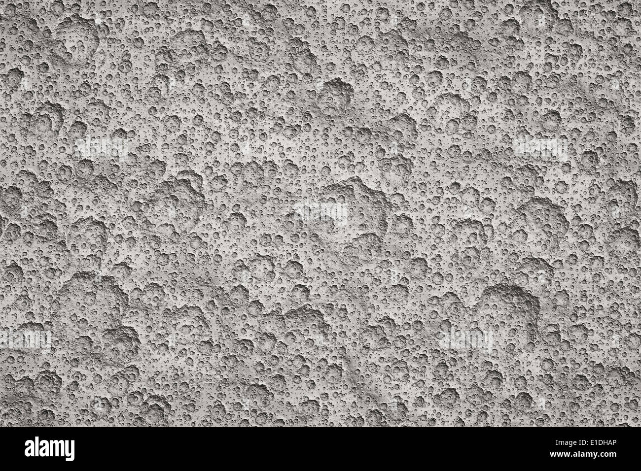 Computer generated graphic design of pits and bumpy on planet surface ...