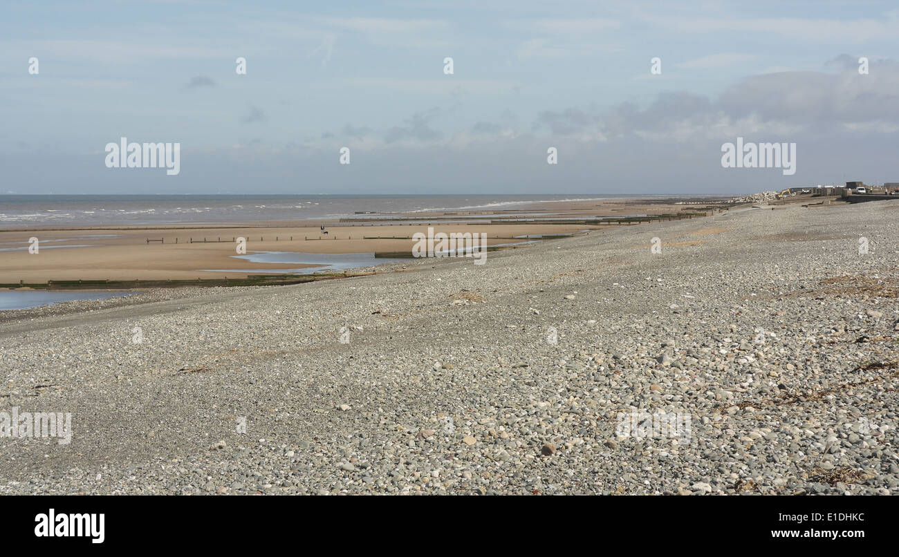 Blue sky grey cumulus clouds view, looking north, low tide shingle ...