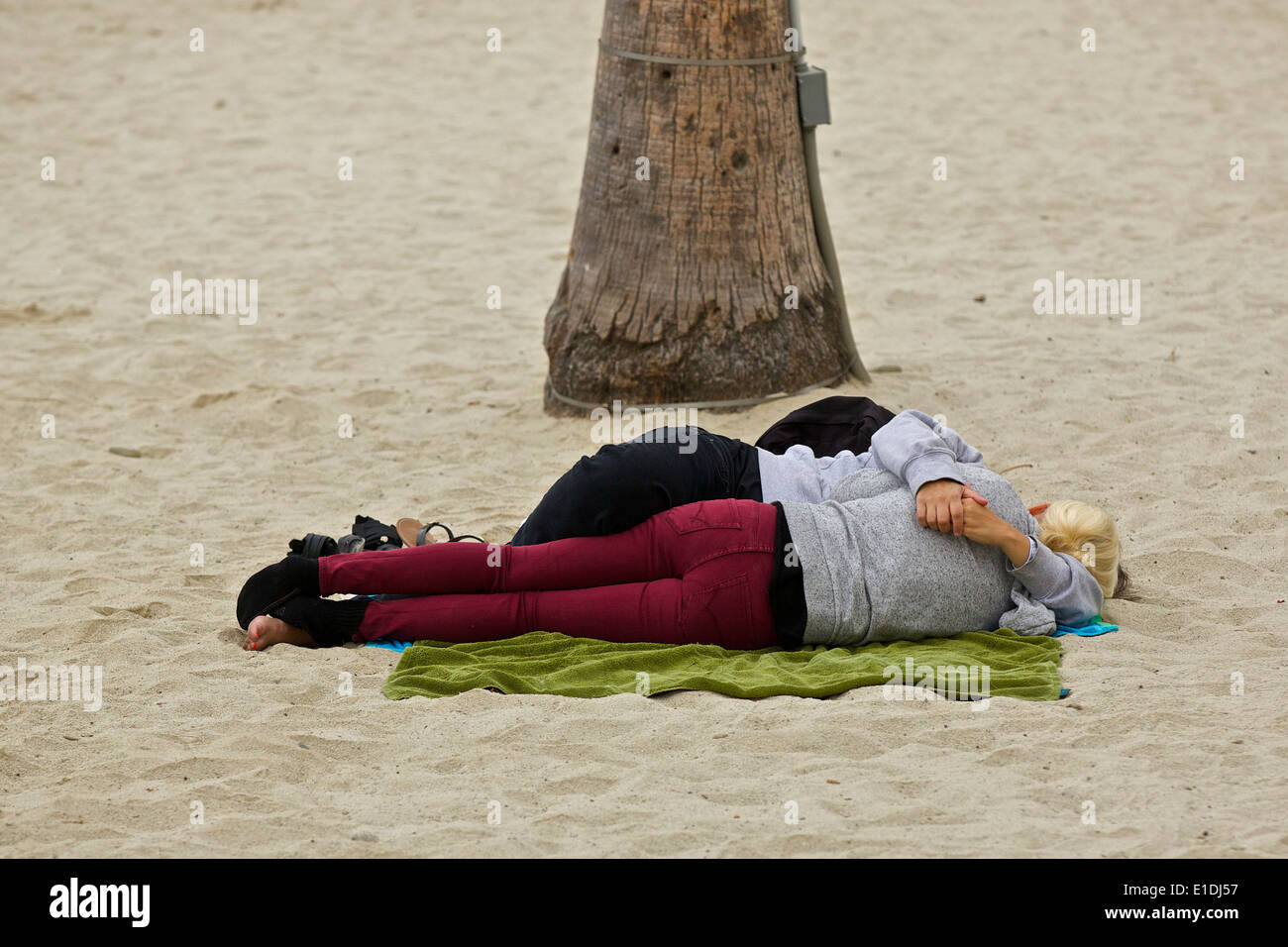 Morning After The Night Before. Two Women Sleeping On the Beach At ...