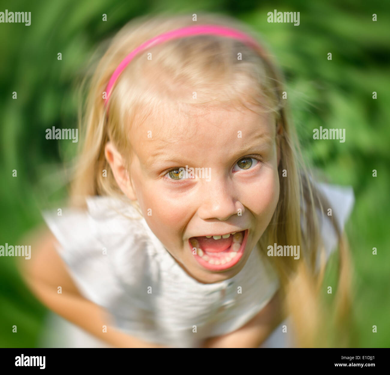Little angry girl screaming at the camera Stock Photo - Alamy