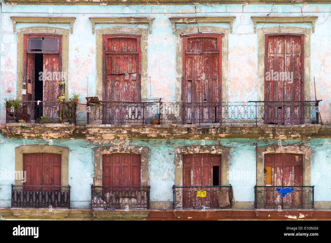 Facade of crumbling building with balconies in Pasea del Industria, Old ...