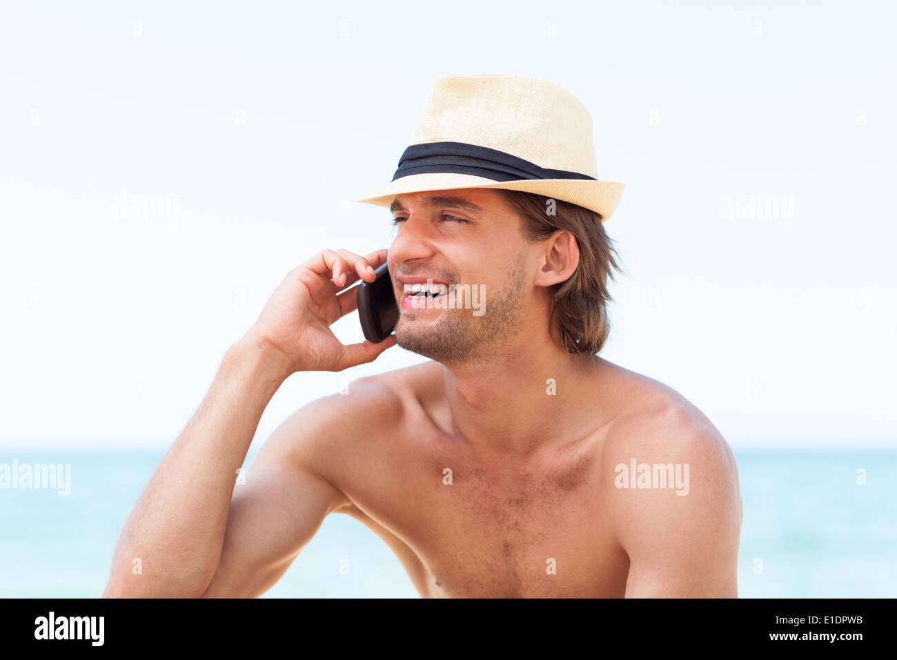Mobile phone call outside beach hi-res stock photography and images - Alamy