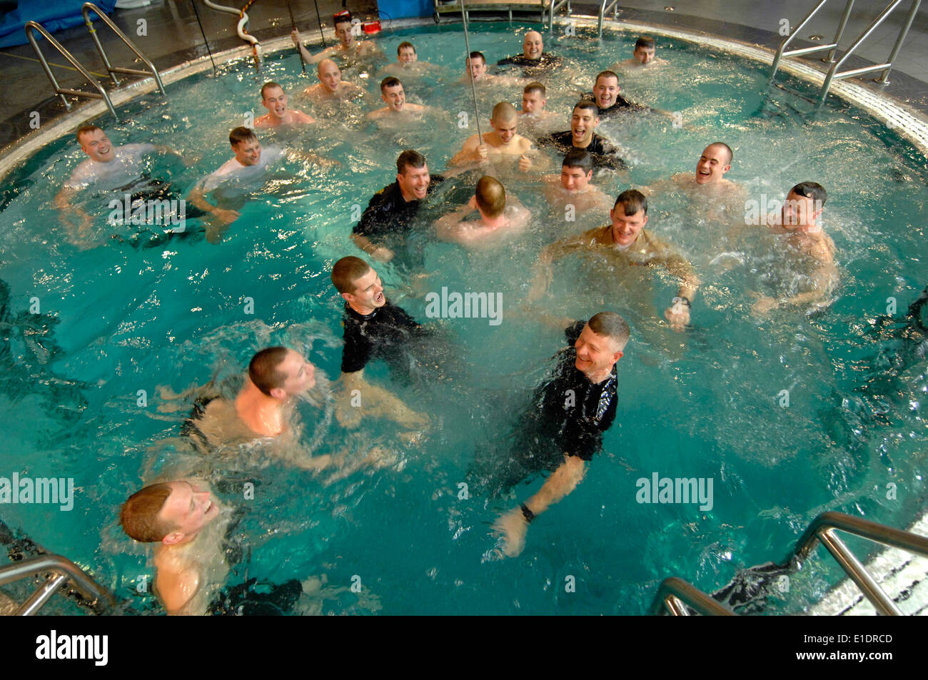 Master Chief Petty Officer of the Navy Rick West, lower right, treads ...