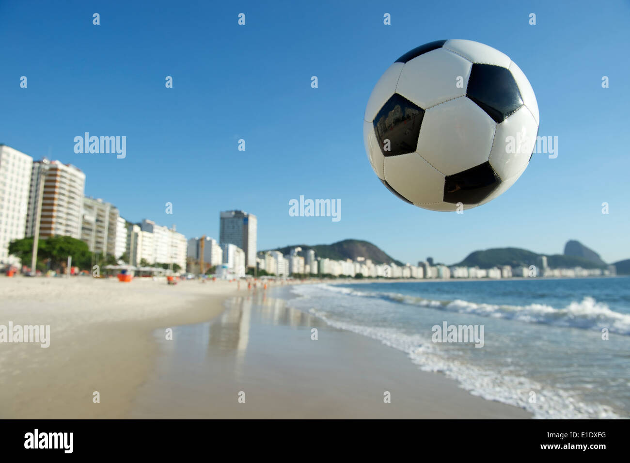 Football soccer ball in the sky above Copacabana Beach Rio de Janeiro ...