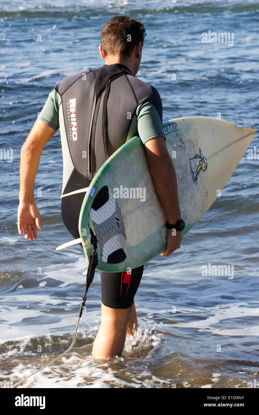 Surfers going for a surf Stock Photo - Alamy