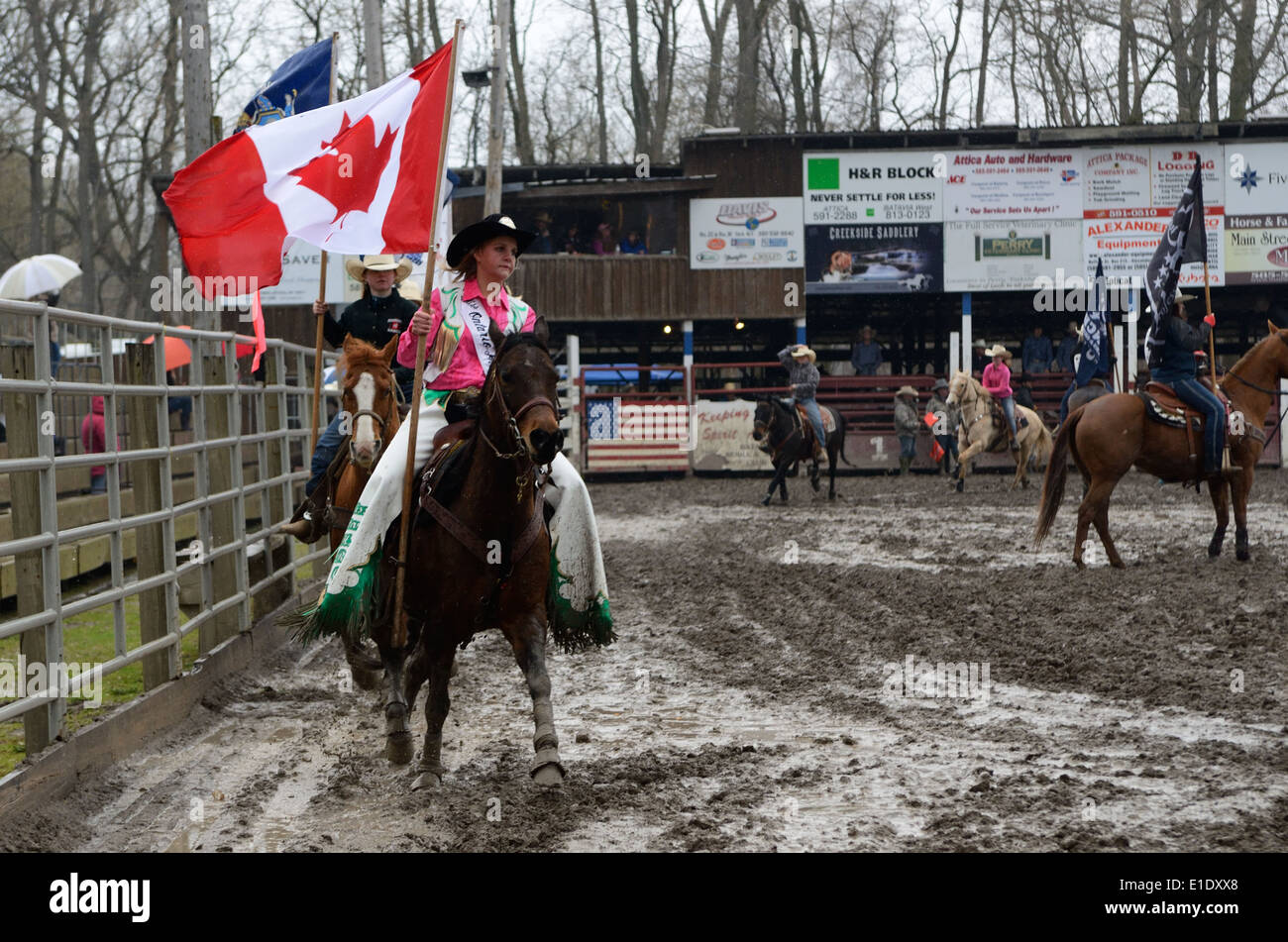 Canadian Rider carries flag around Rodeo Arena Stock Photo - Alamy