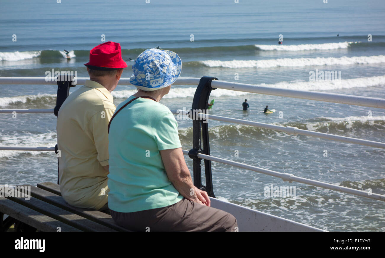 Elderly lady looking out to sea hi-res stock photography and images - Alamy