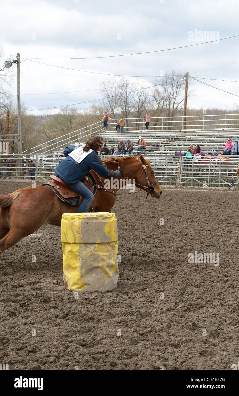 Teenage high school girl competes in barrel racing Stock Photo - Alamy