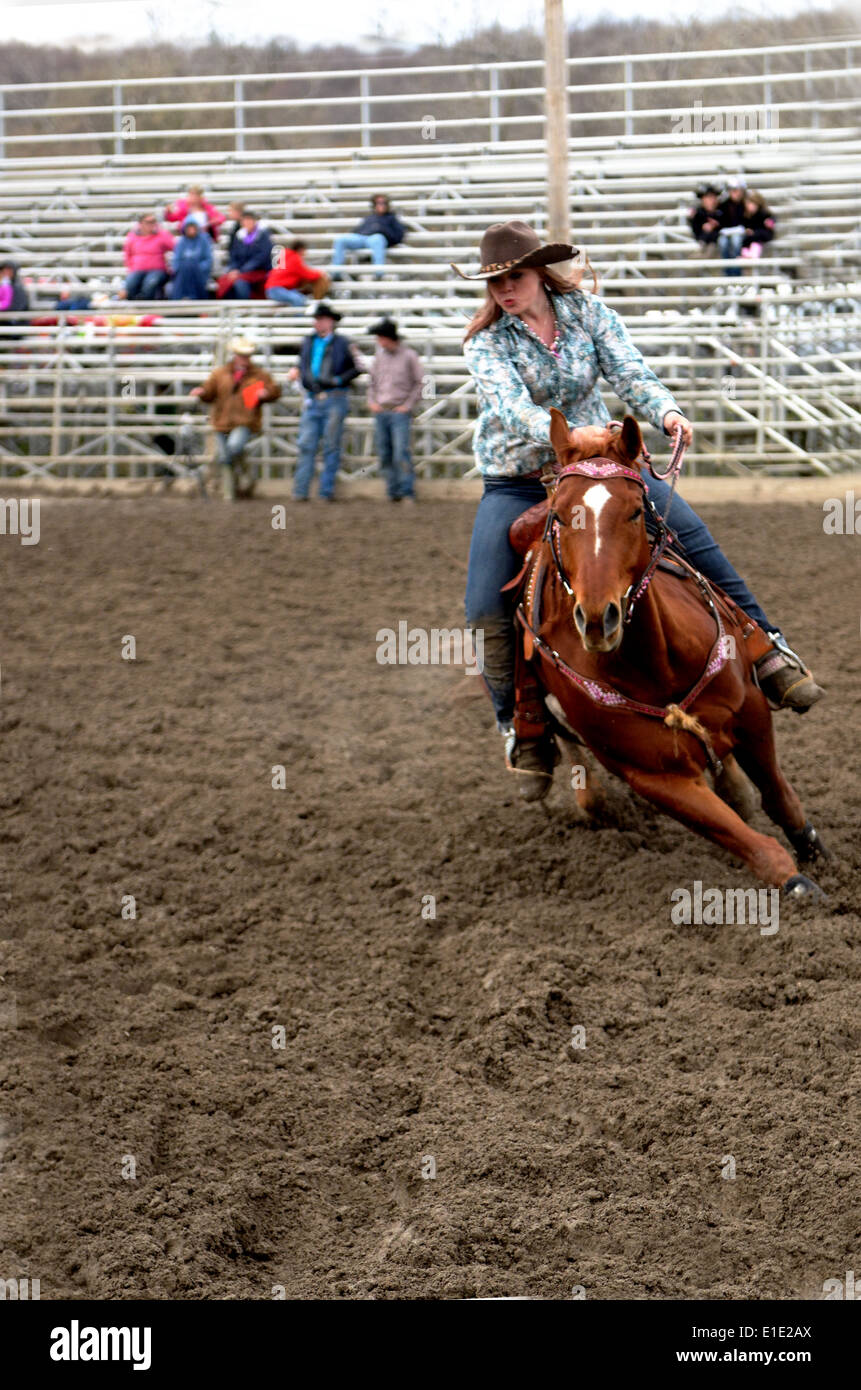 Teenage high school girl competes in barrel racing Stock Photo - Alamy